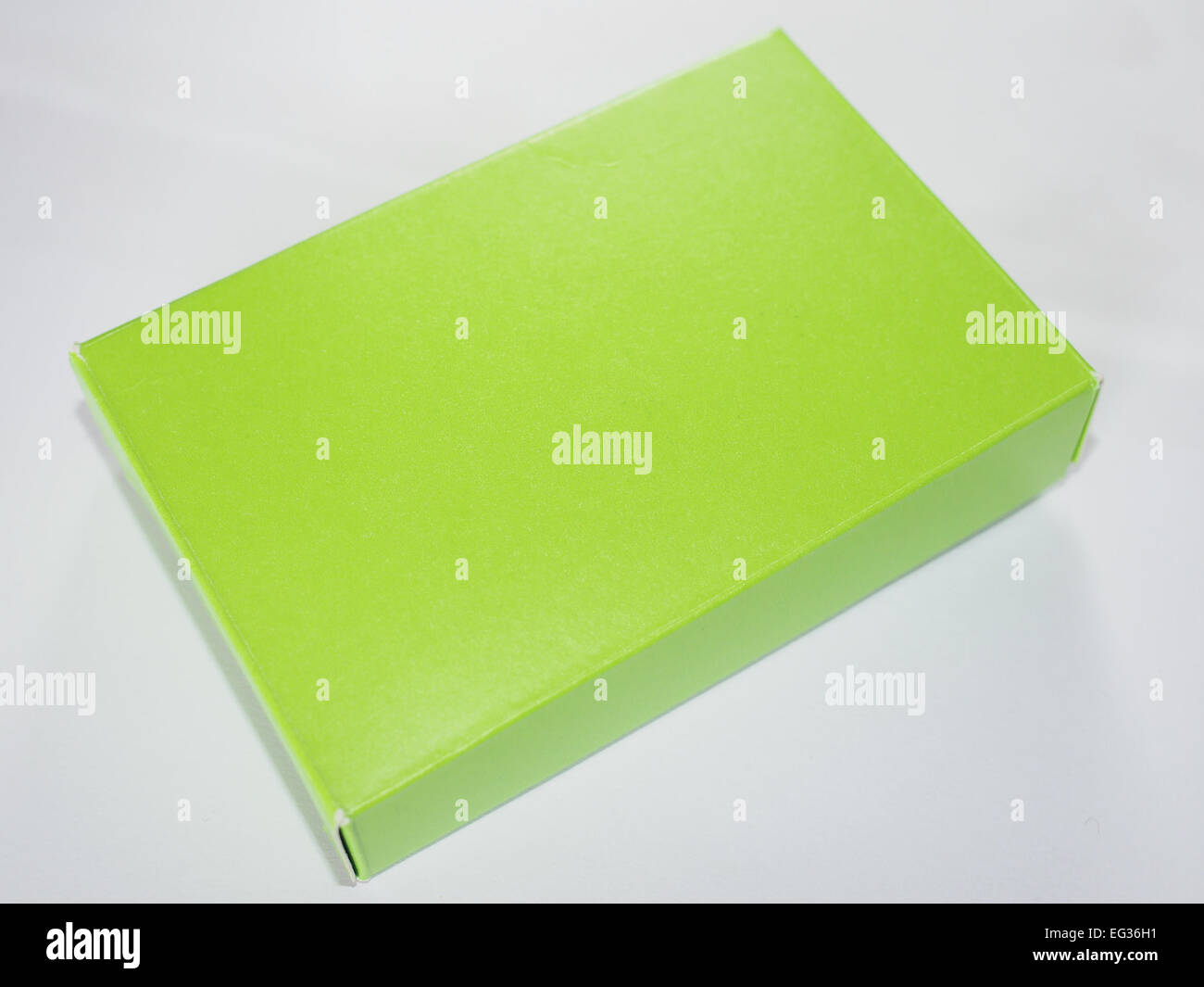Green yellow paper box packet Stock Photo - Alamy