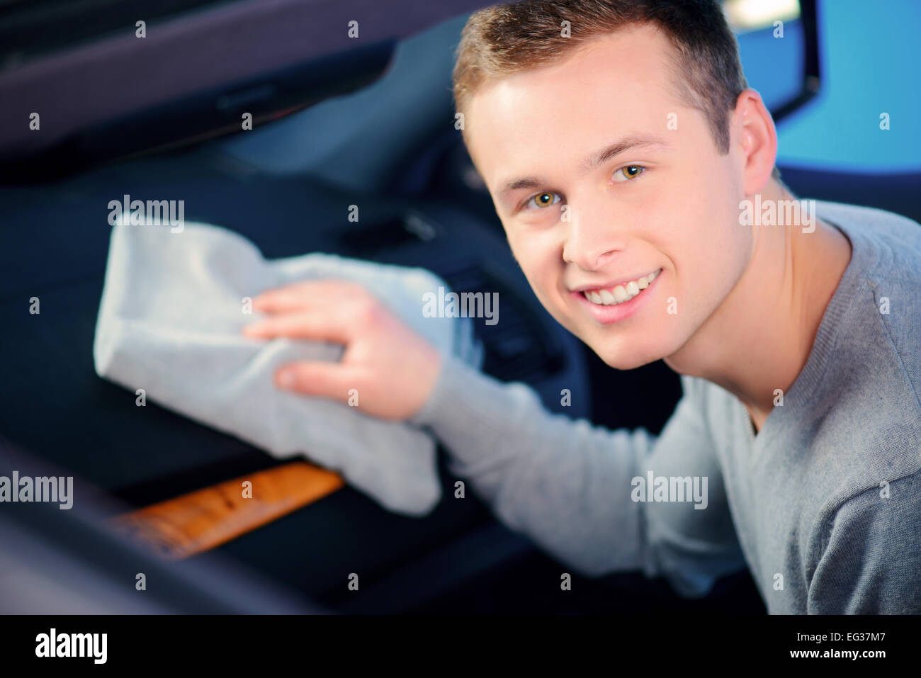 Handsome man cleaning his car Stock Photo - Alamy