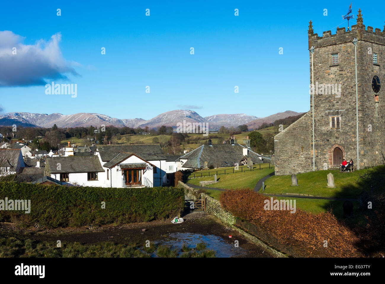 Hawkshead Church and Village with The Lakeland Mountains in the ...