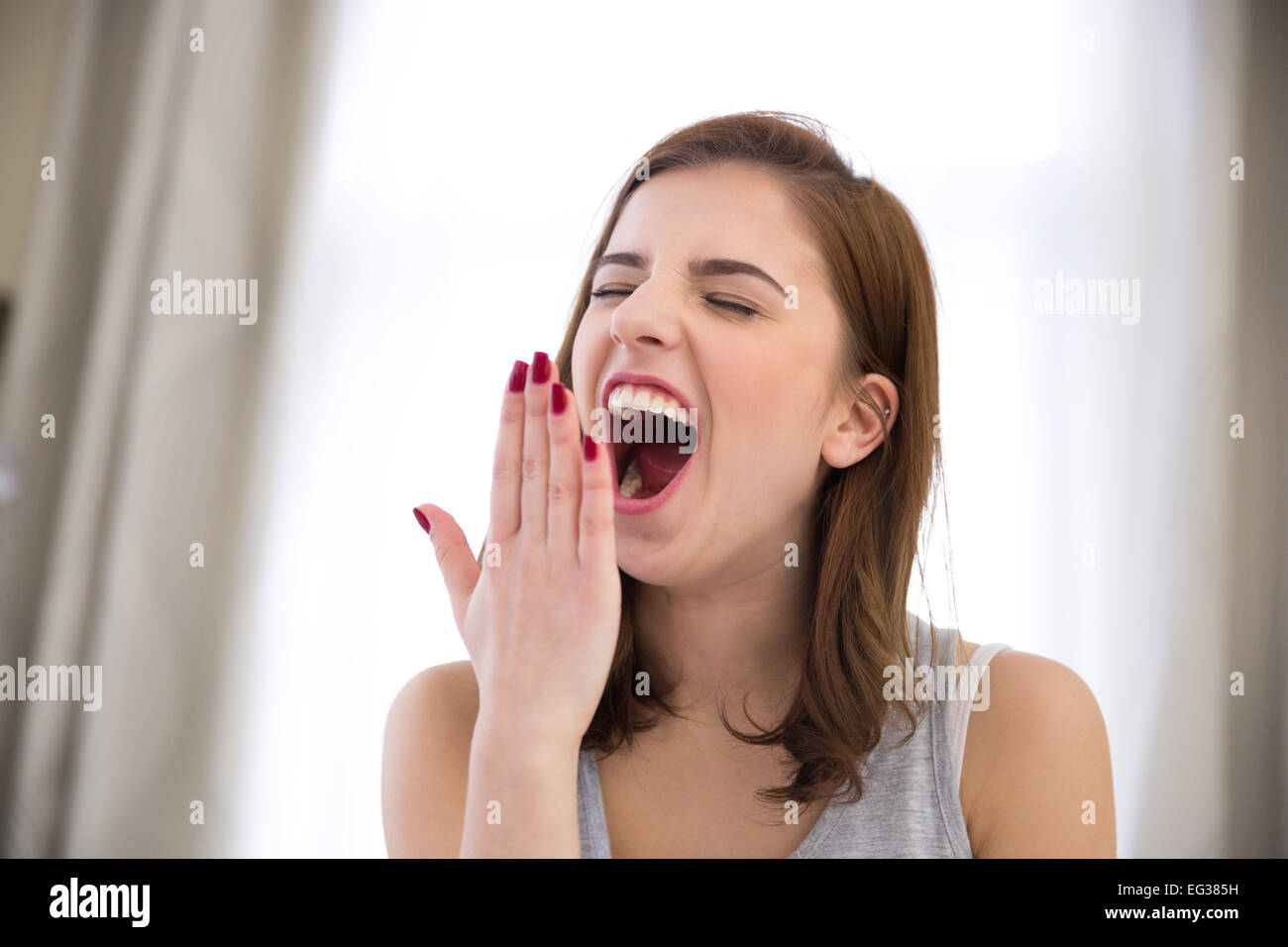 Woman yawning hi-res stock photography and images - Alamy