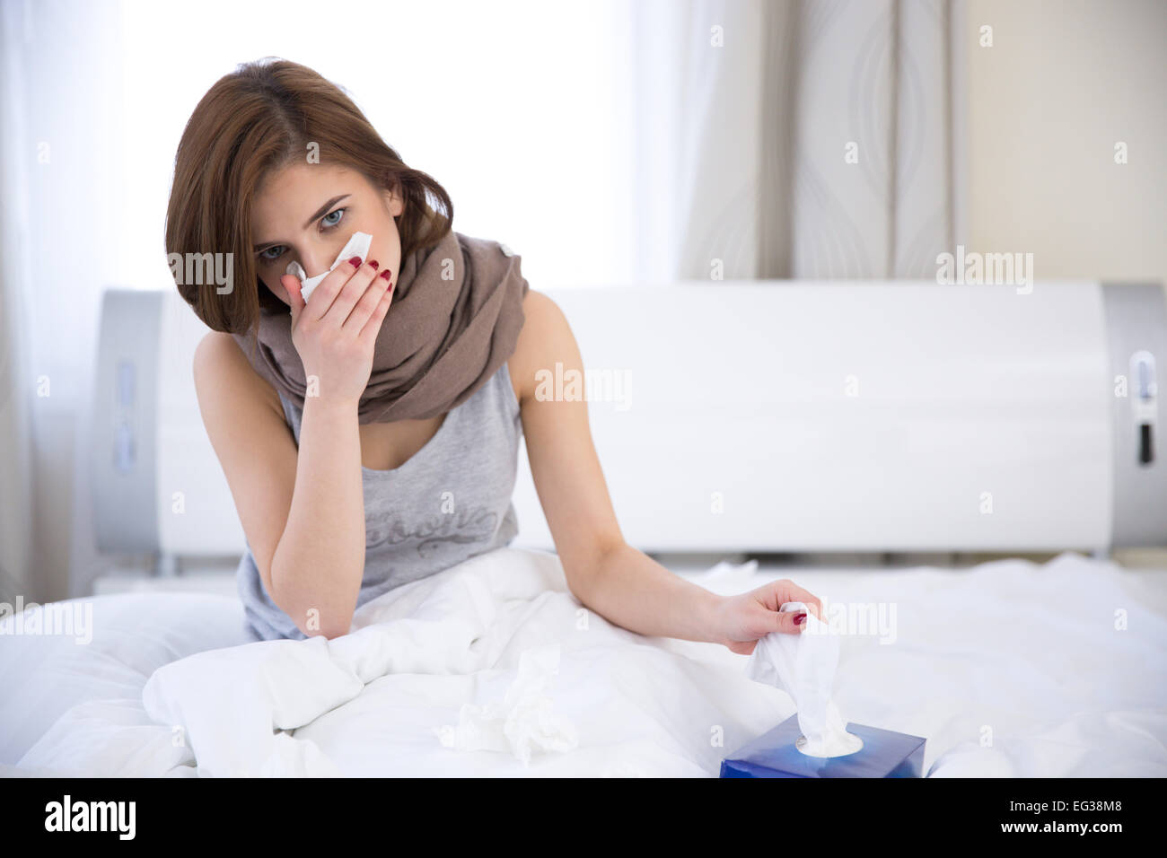 Portrait of sick woman on the bed at home Stock Photo - Alamy