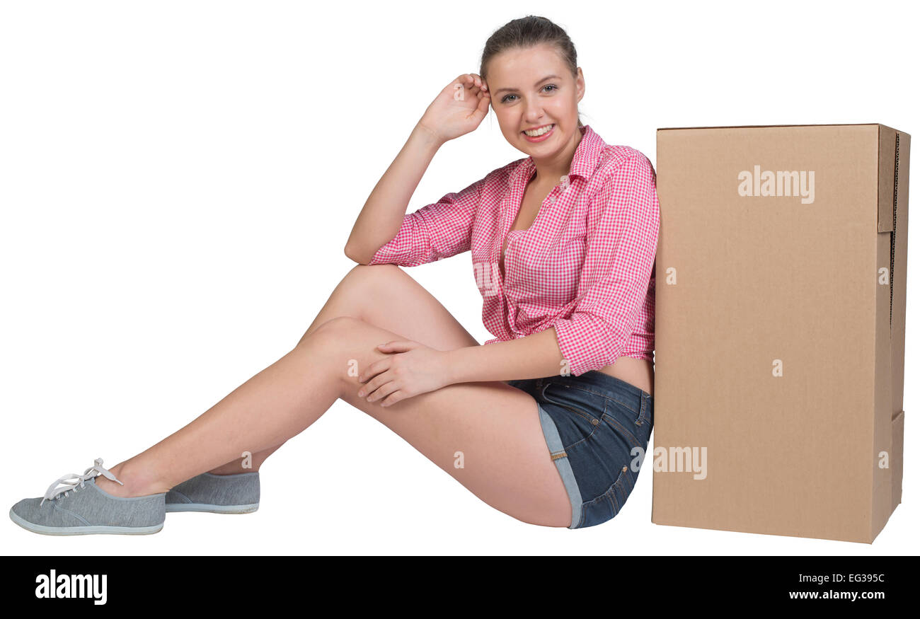 Woman sitting next to cardboard box Stock Photo - Alamy