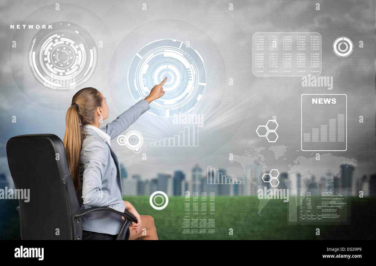 Businesswoman using virtual interface Stock Photo - Alamy
