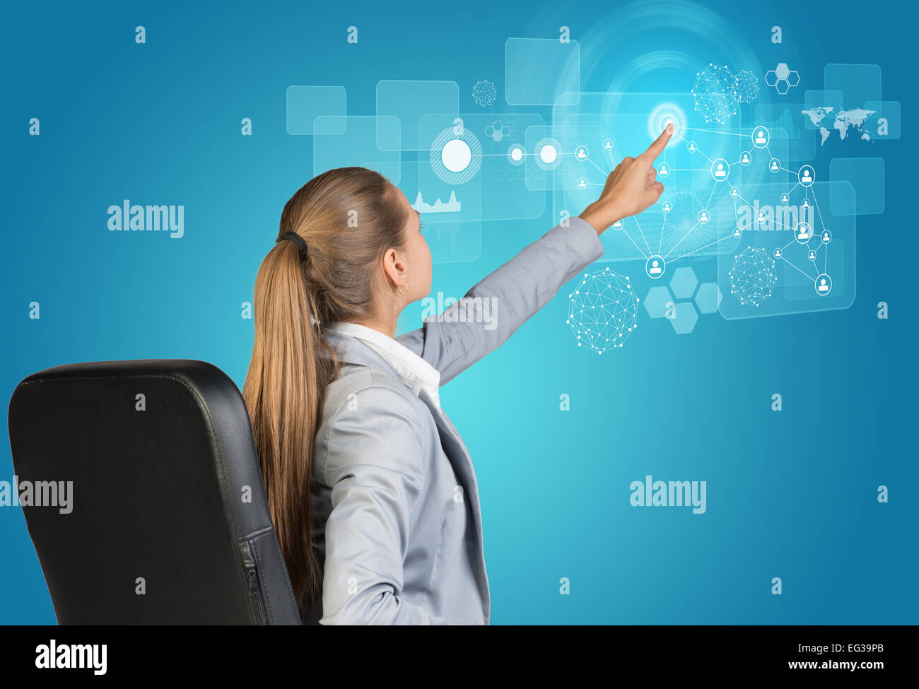 Businesswoman pressing virtual interface Stock Photo - Alamy