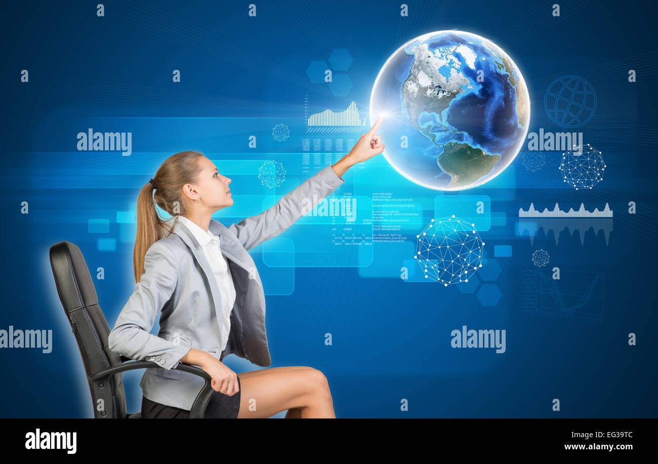 Businesswoman using virtual interface Stock Photo - Alamy