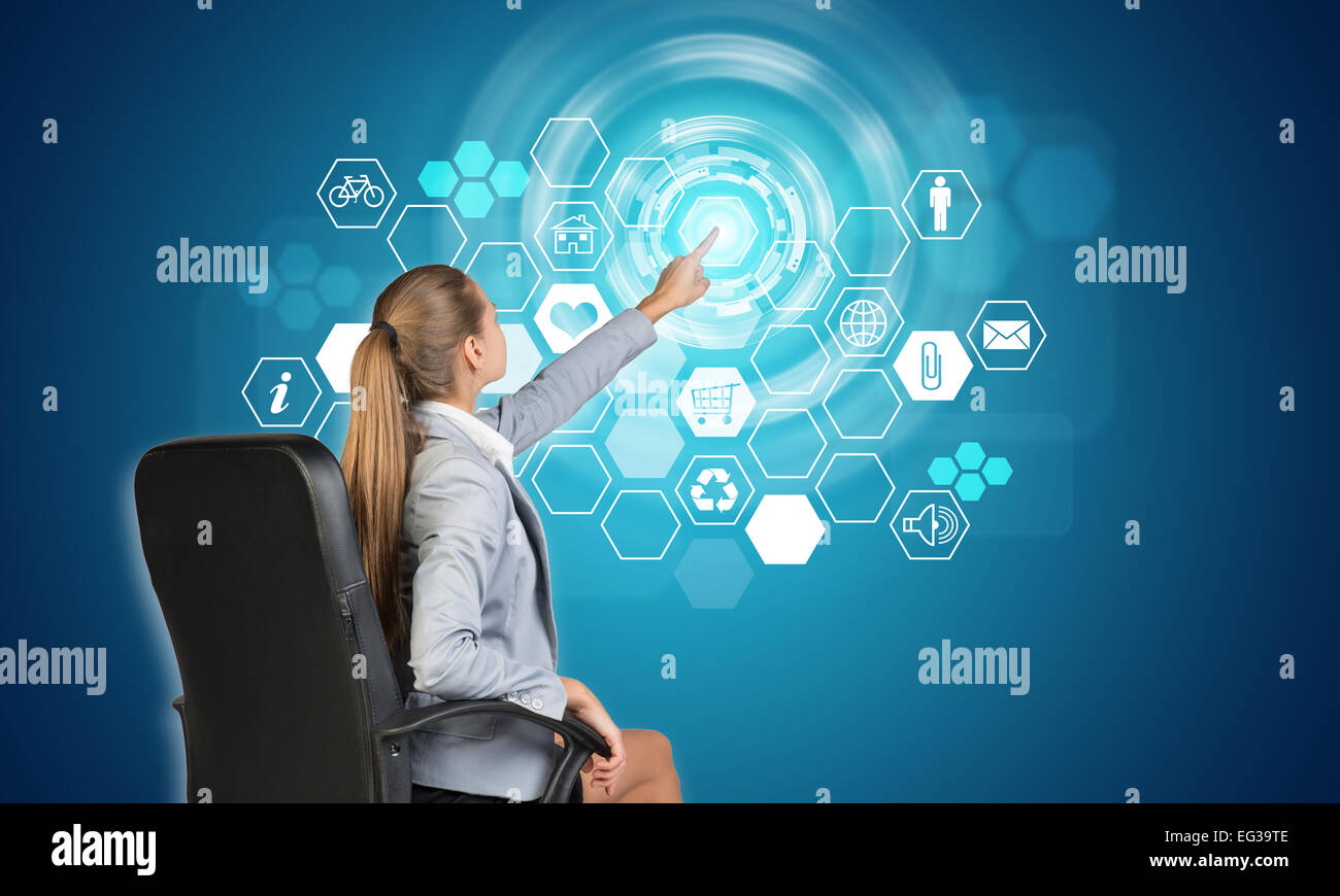 Businesswoman pressing touch screen button on virtual interface Stock ...