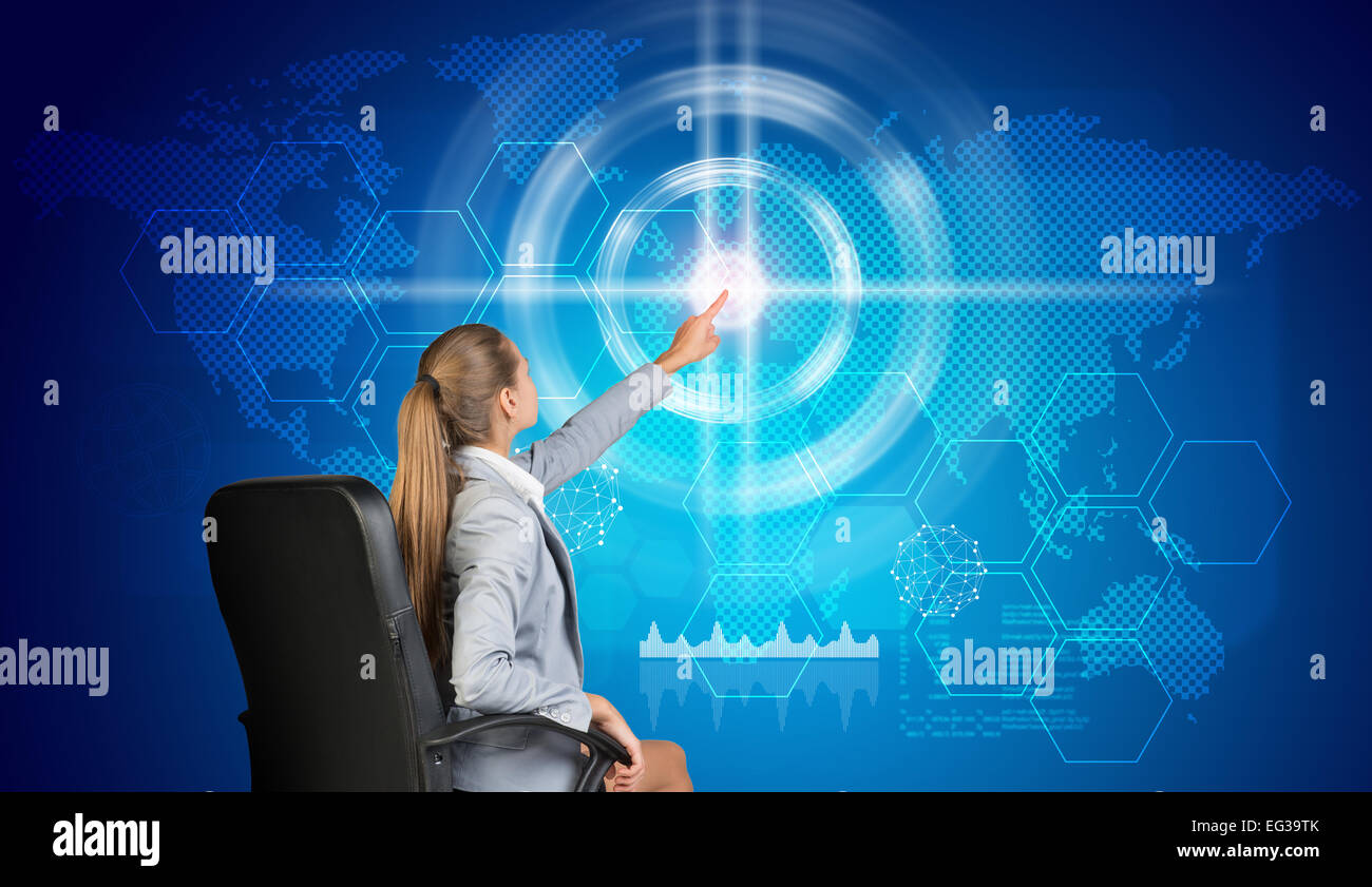 Businesswoman using virtual interface Stock Photo - Alamy
