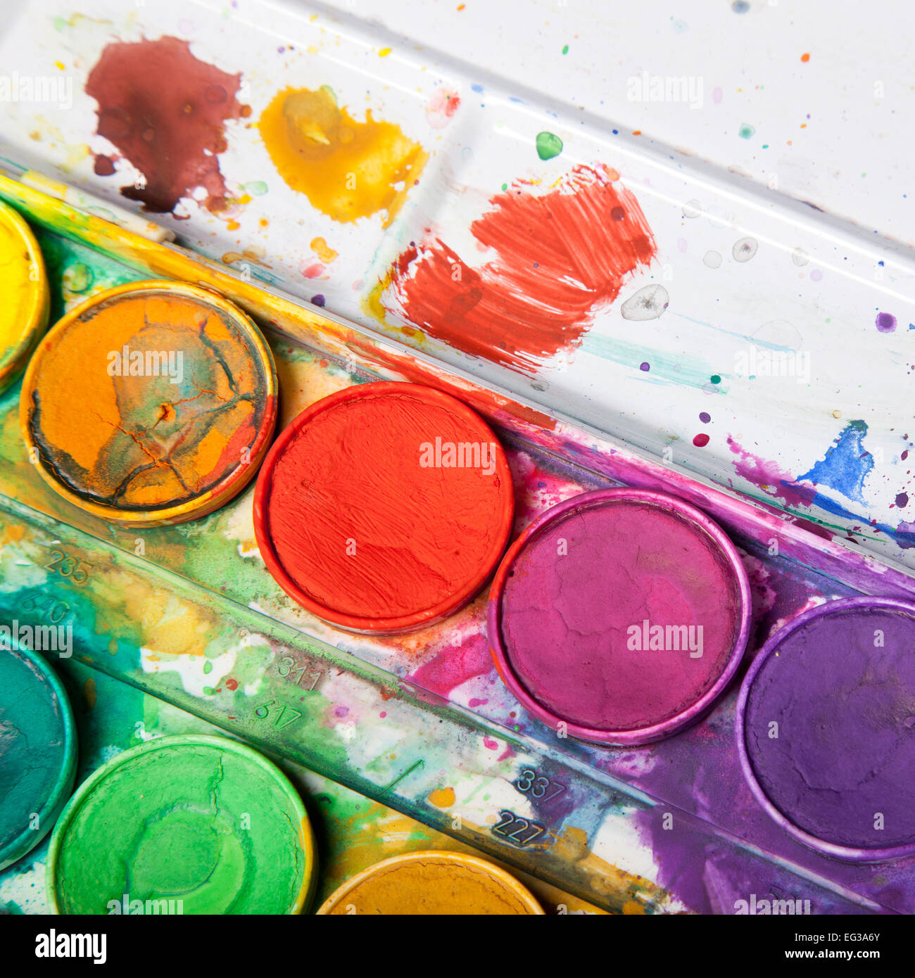 bright colors for watercolor painting in messy box Stock Photo - Alamy