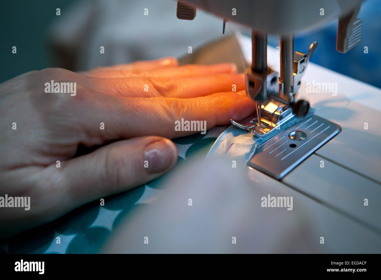 Sewing on sewing machine Stock Photo - Alamy