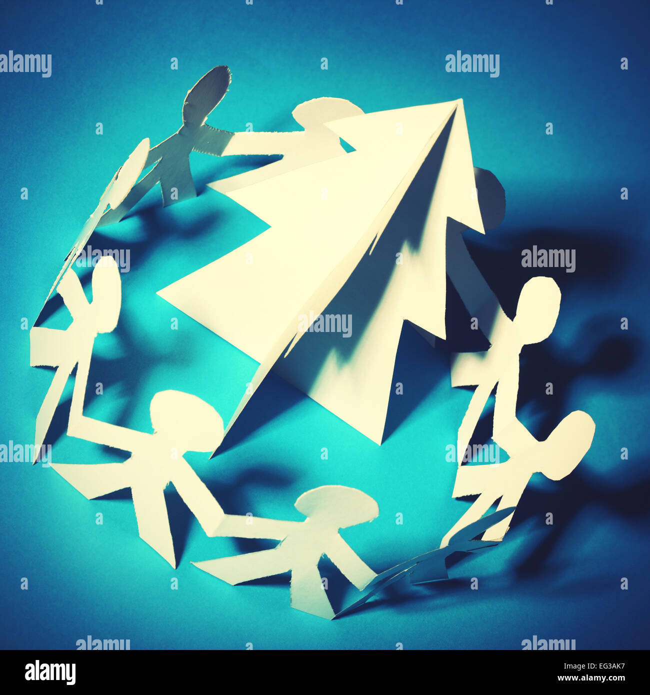 Paper people dancing around Christmas tree Stock Photo - Alamy