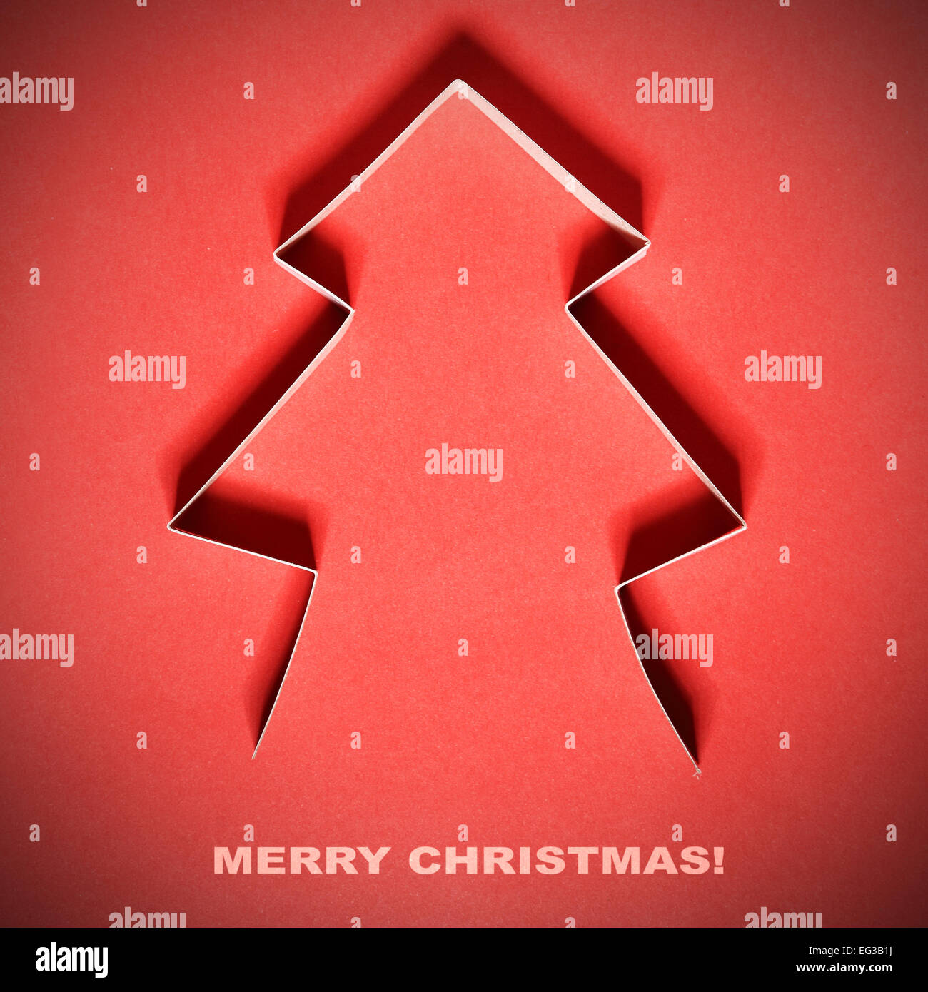 Paper Christmas tree on the red background Stock Photo - Alamy