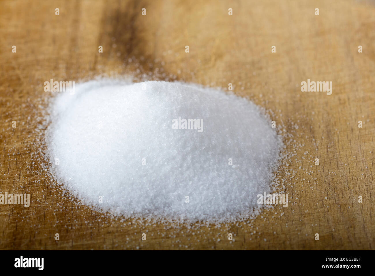 Heap of salt over wood background Stock Photo - Alamy
