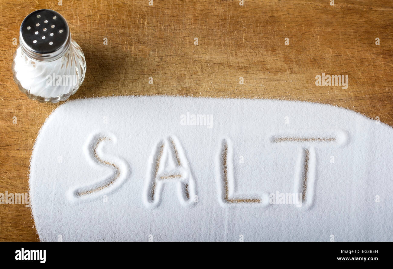 Word salt on a wood kitchen table Stock Photo - Alamy