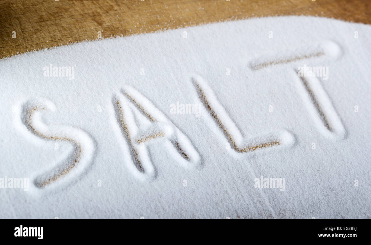 Word salt on a wood kitchen table Stock Photo - Alamy