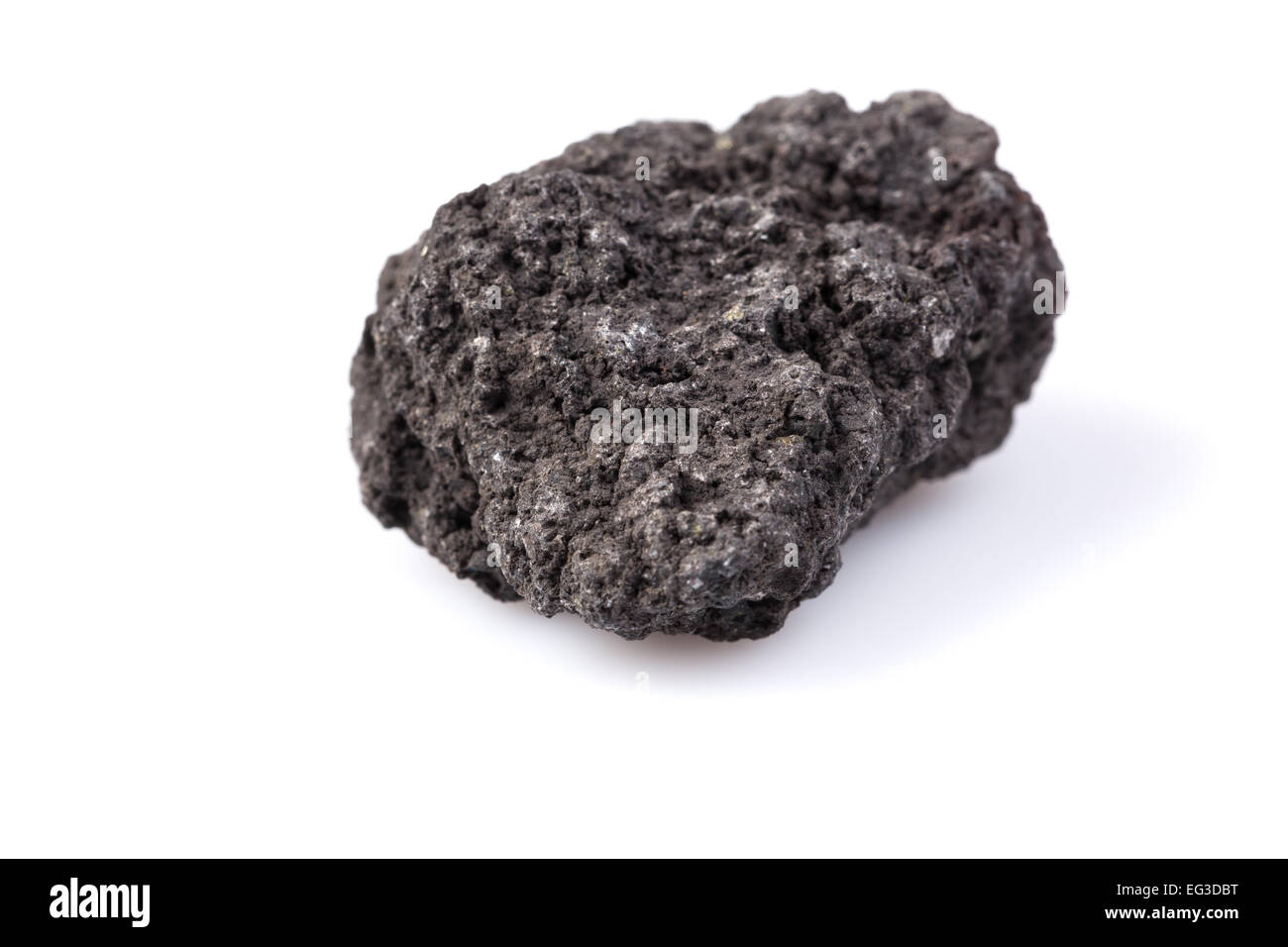 Black lava rock from volcano on a white background Stock Photo - Alamy
