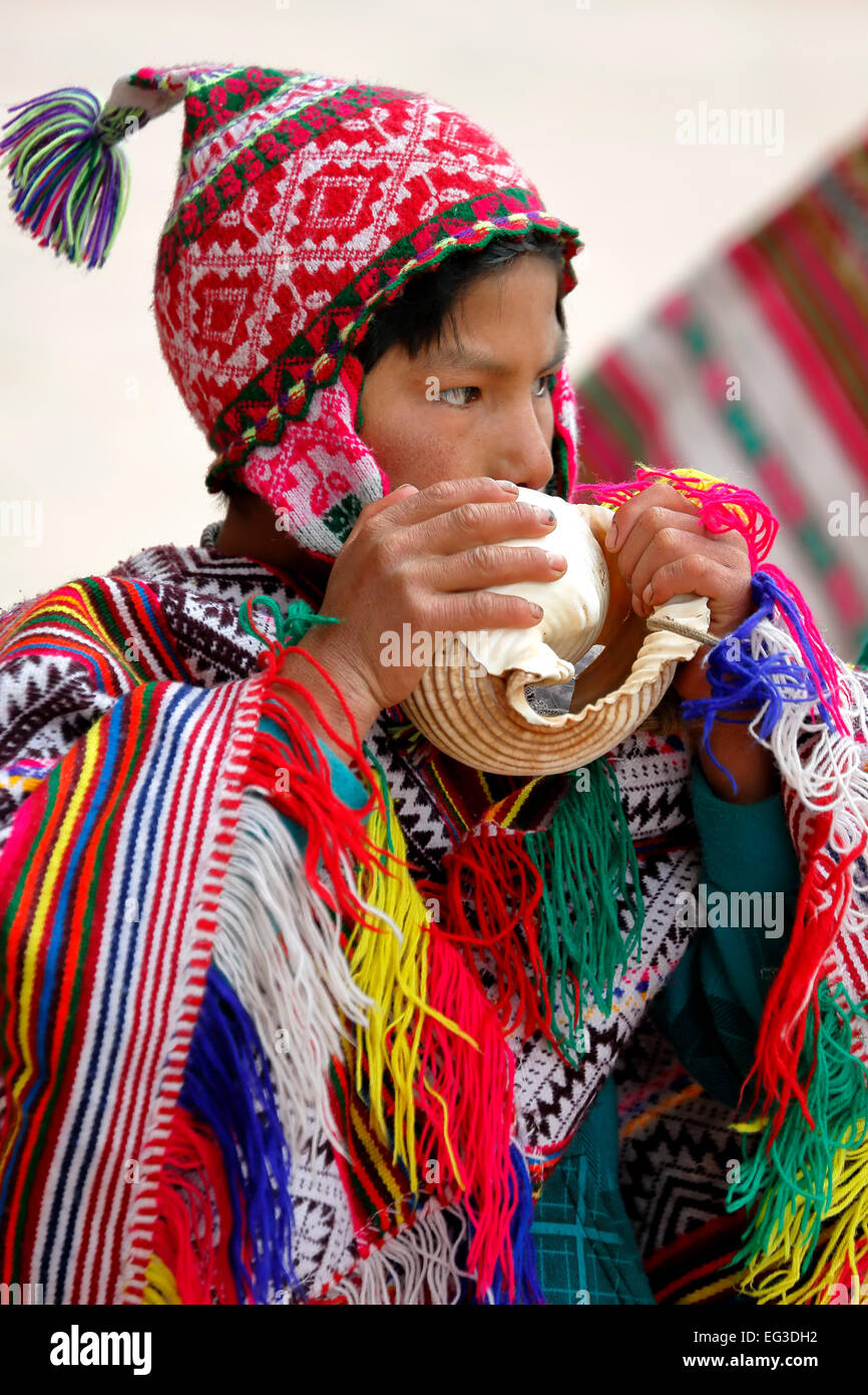 Boy blowing conch hi-res stock photography and images - Alamy