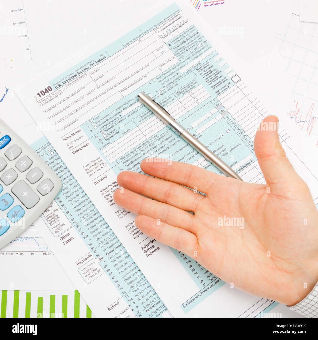 US 1040 Tax Form, calculator and male hand Stock Photo - Alamy