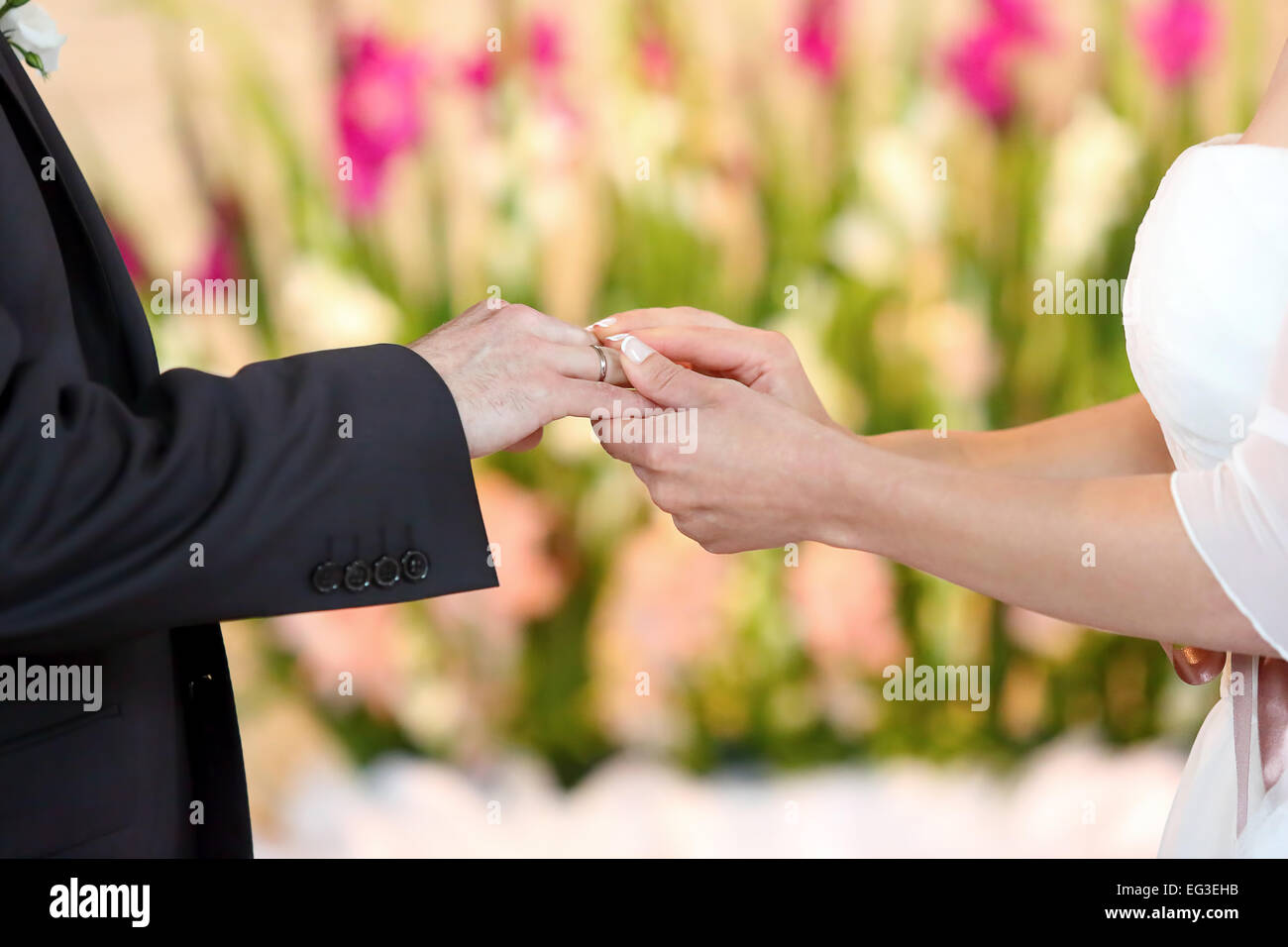 Couple having their wedding ceremony in church ring exchange Stock ...
