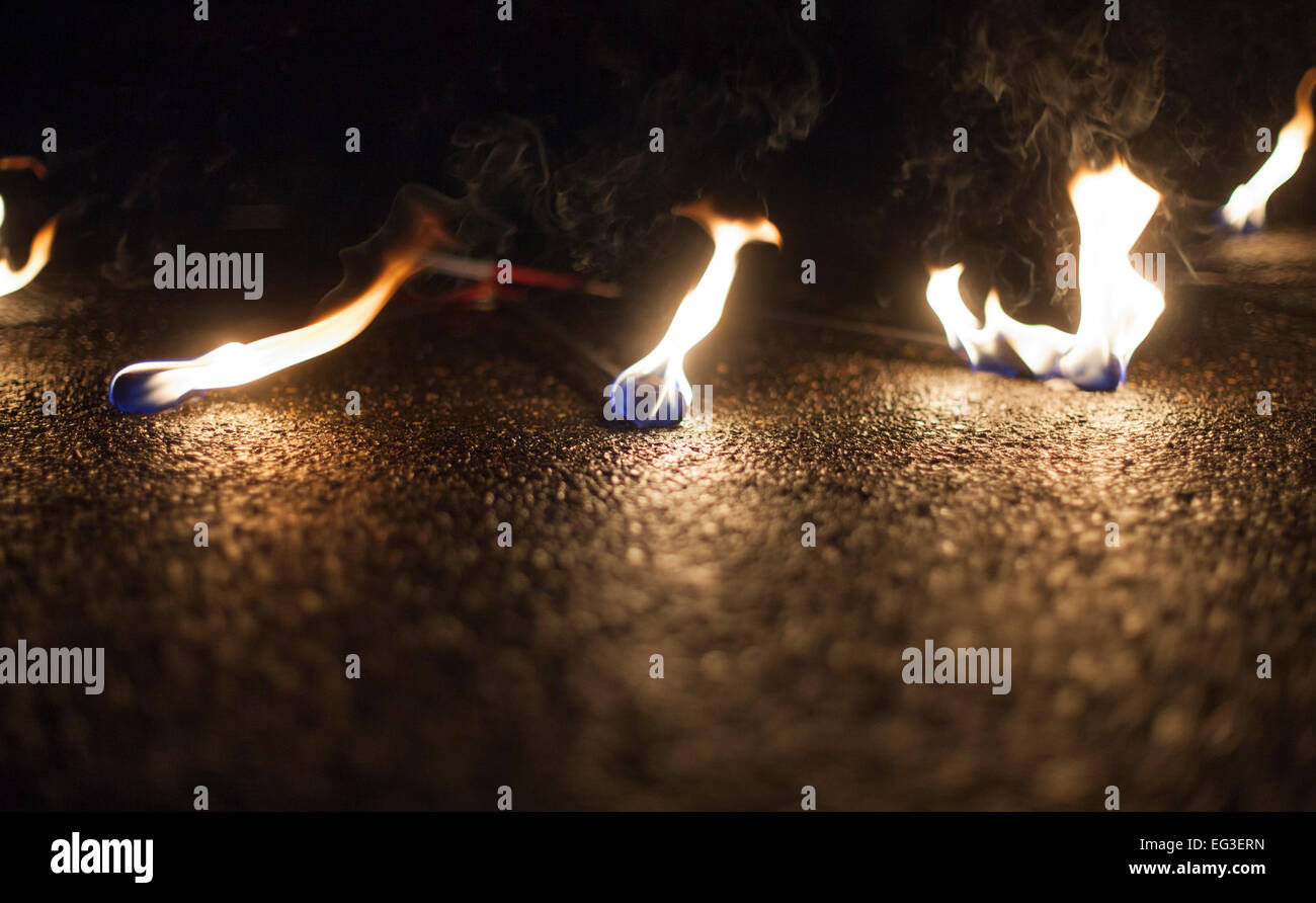 Multiple Wick Fires laying on the reflective ground Stock Photo - Alamy
