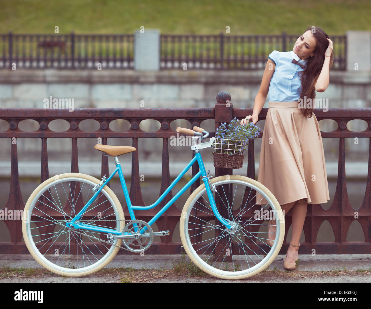 Young beautiful, elegantly dressed woman with bicycle. Beauty, fashion ...