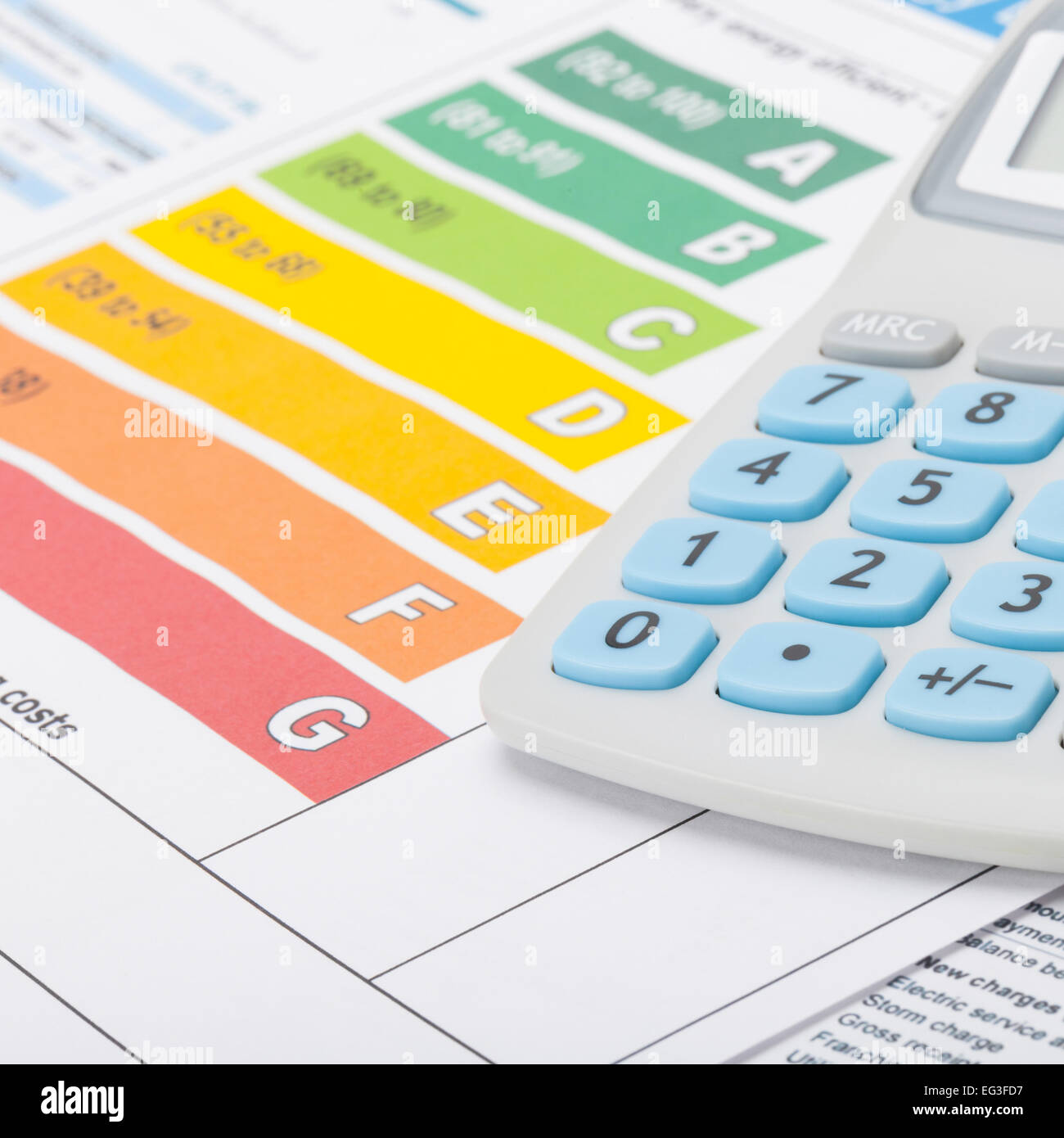 Colorful energy efficiency chart with calculator - studio shot Stock ...