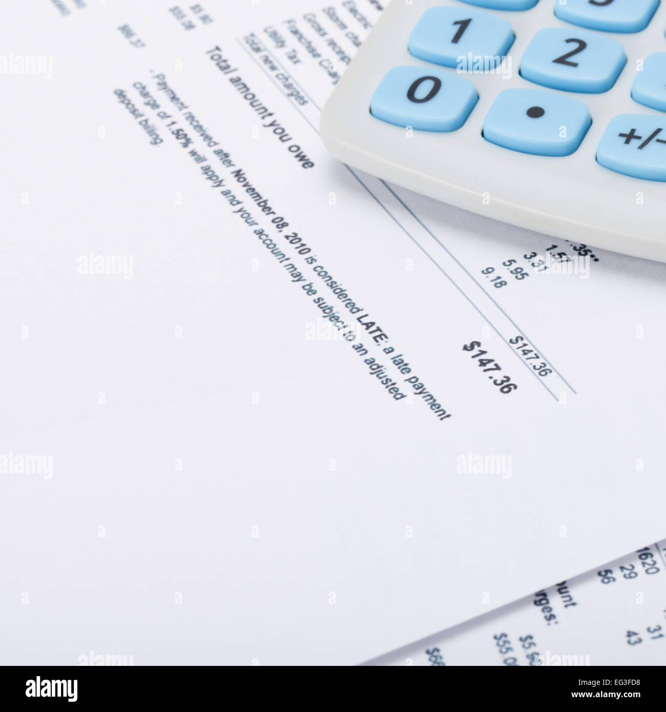 Receipt with calculator next to it Stock Photo - Alamy