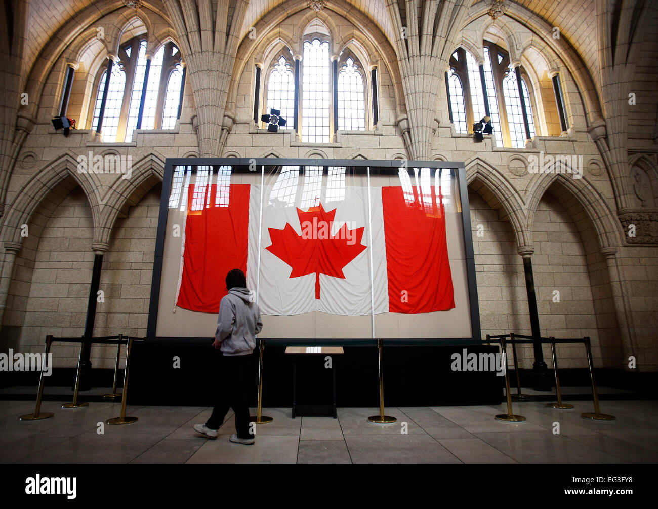 Ottawa. 15th Feb, 2015. A person inspects the first Canadian flag flown ...