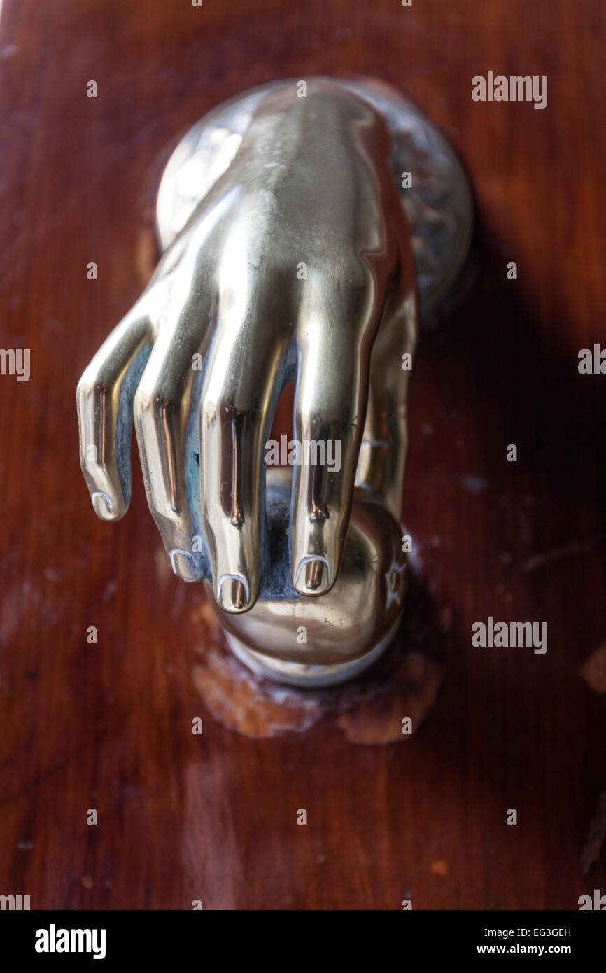 Hand bronze knocker in Cadiz Stock Photo - Alamy
