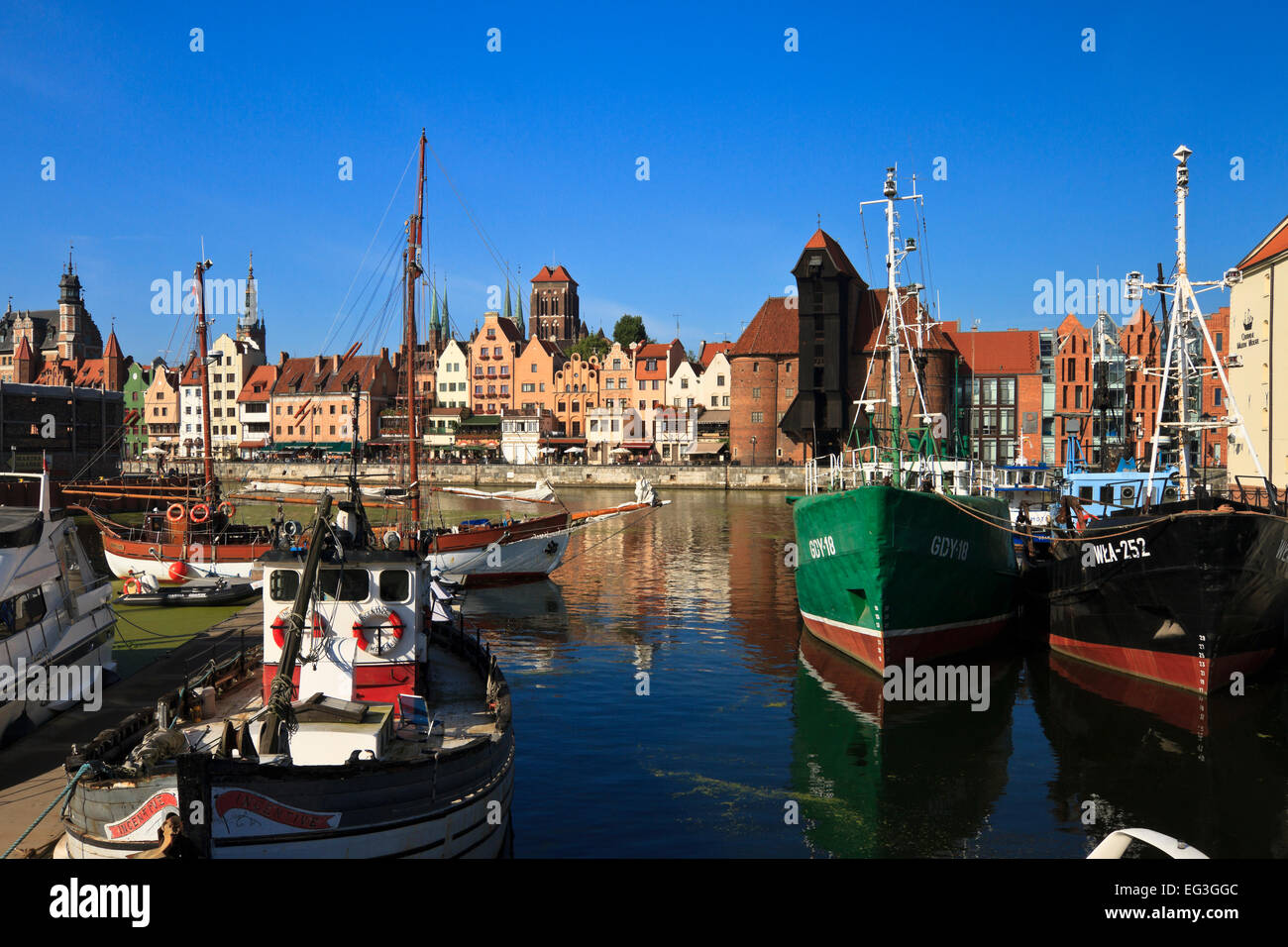 Yacht harbor in Gdansk with the famous crane and the old city in the ...