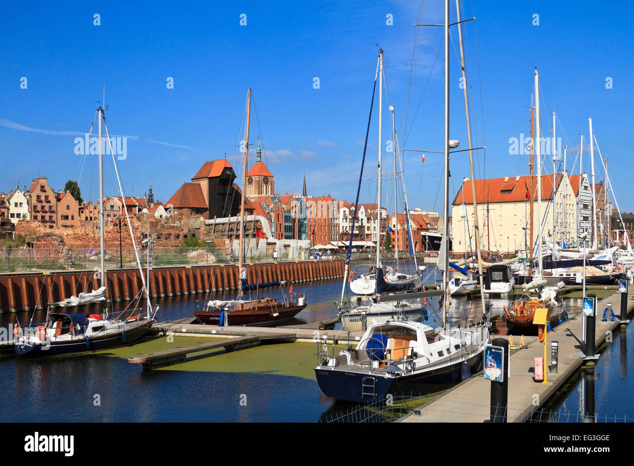 Yacht harbor in Gdansk with the famous crane and the old city in the ...