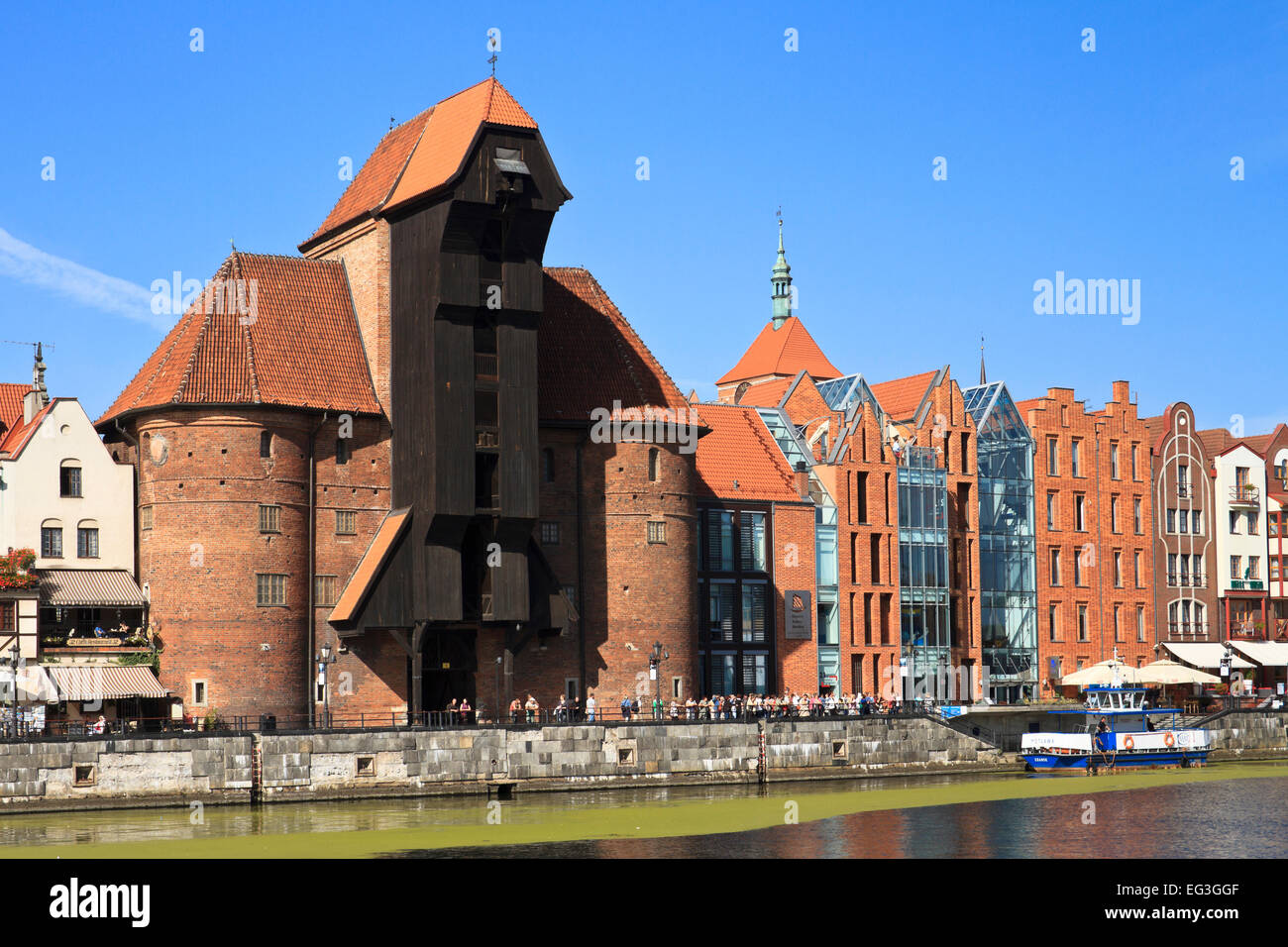 Old harbor in Gdansk with distinctive wooden crane over Motlawa river ...