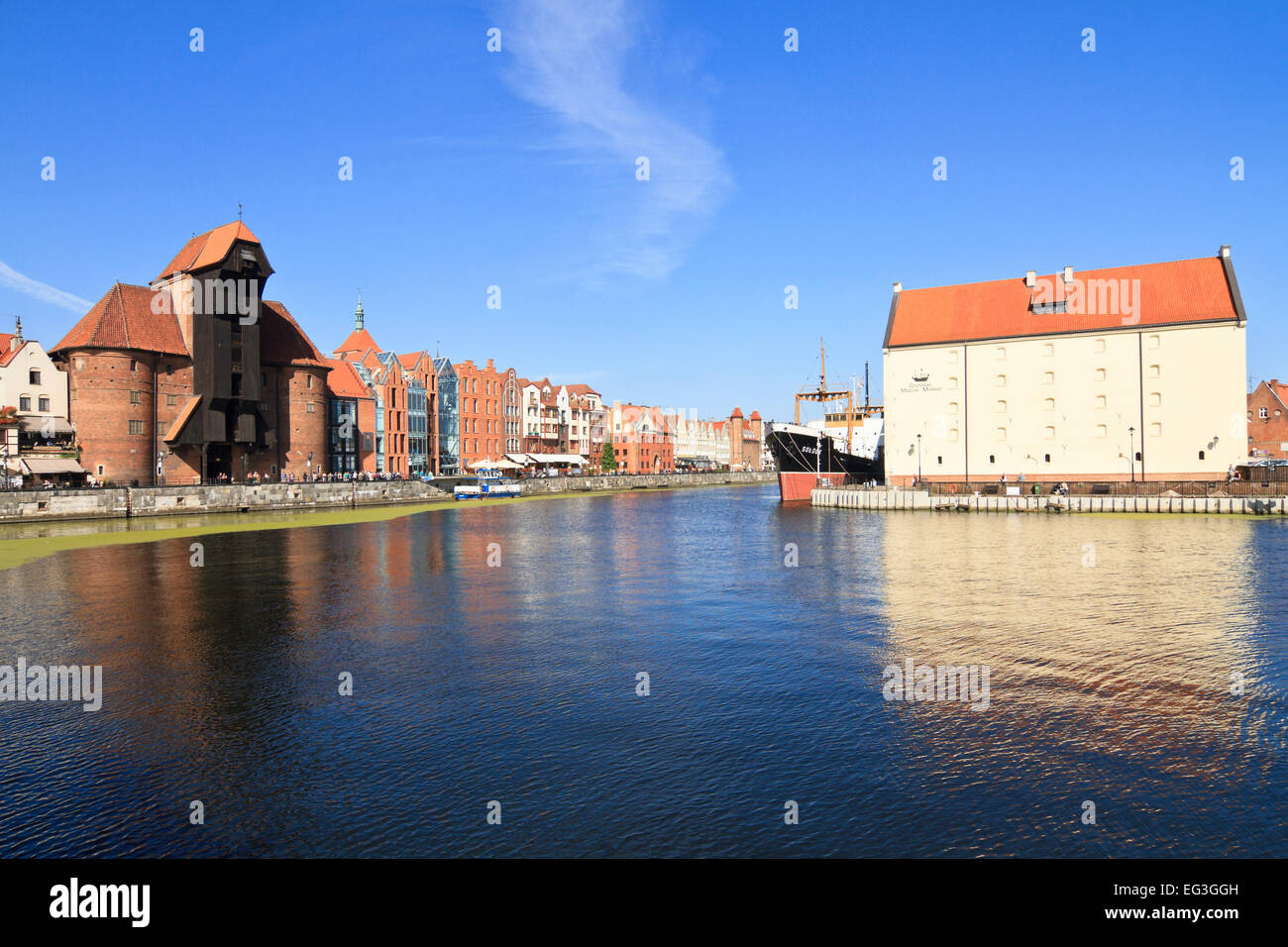 Old harbor in Gdansk with distinctive wooden crane over Motlawa river ...
