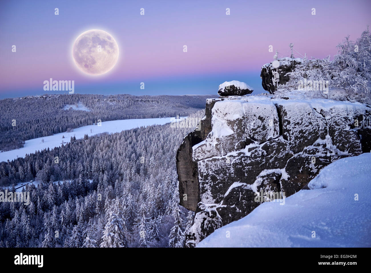 Full moon up the mountain forest in morning snow Stock Photo - Alamy