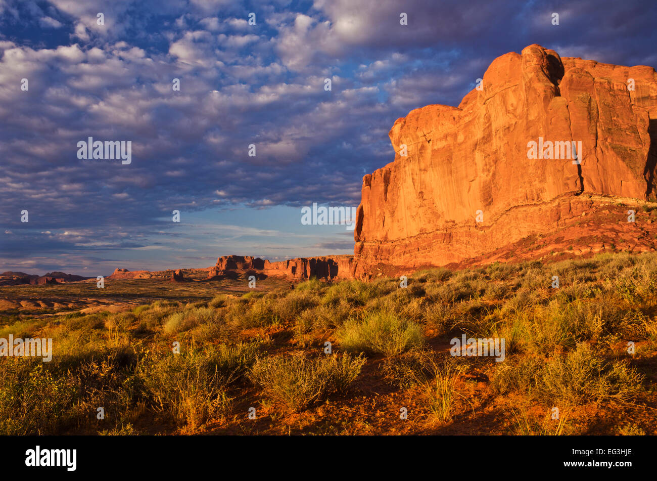 Orange cliffs glowing in the dawn light in Arches National Park, Utah ...