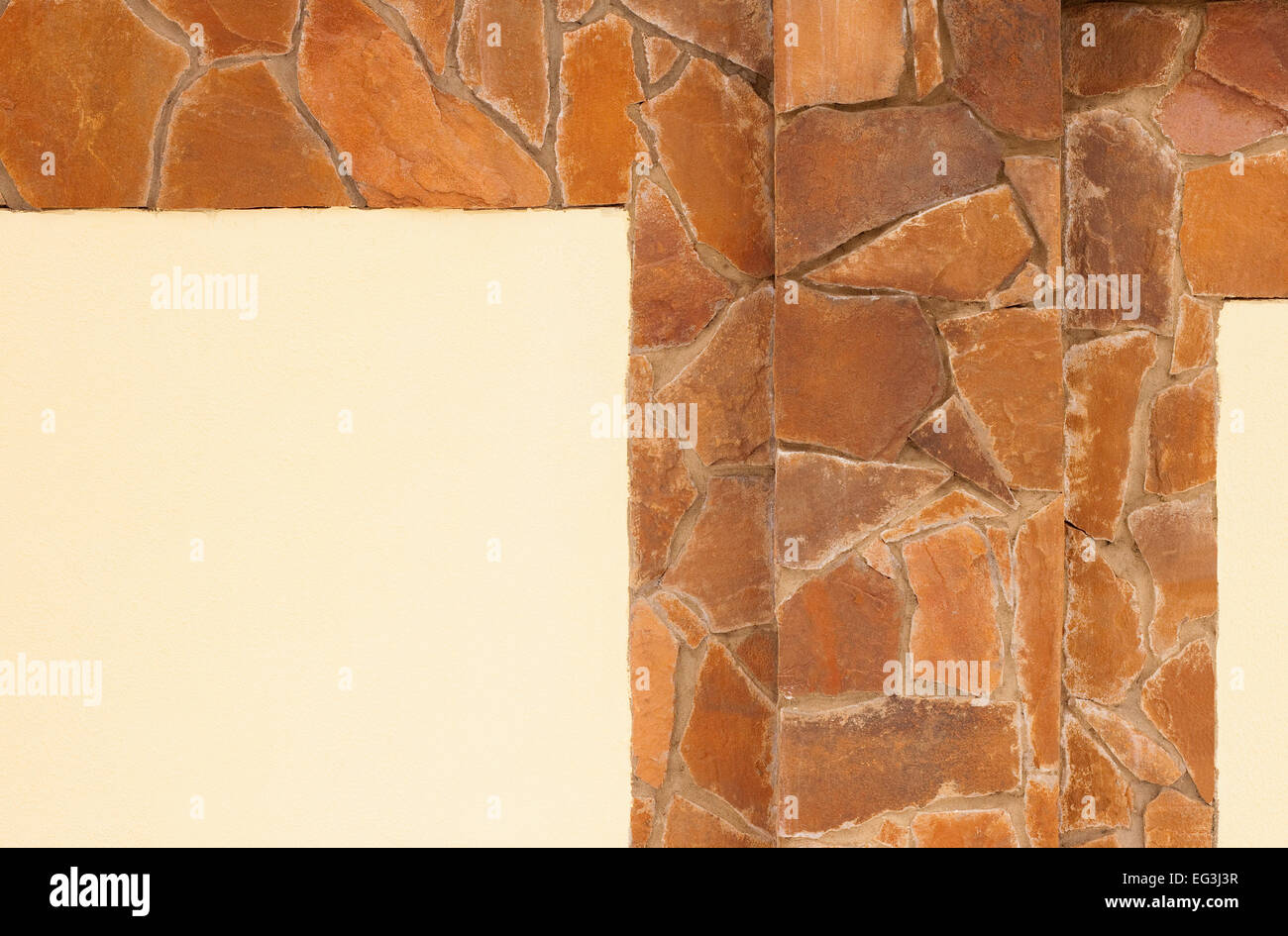 yellow stone wall with plaster Stock Photo - Alamy