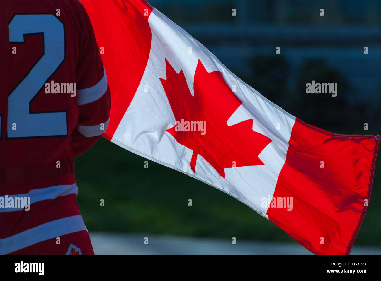 Canadian flag carried by Team Canada fans during 2010 Winter Olympic ...