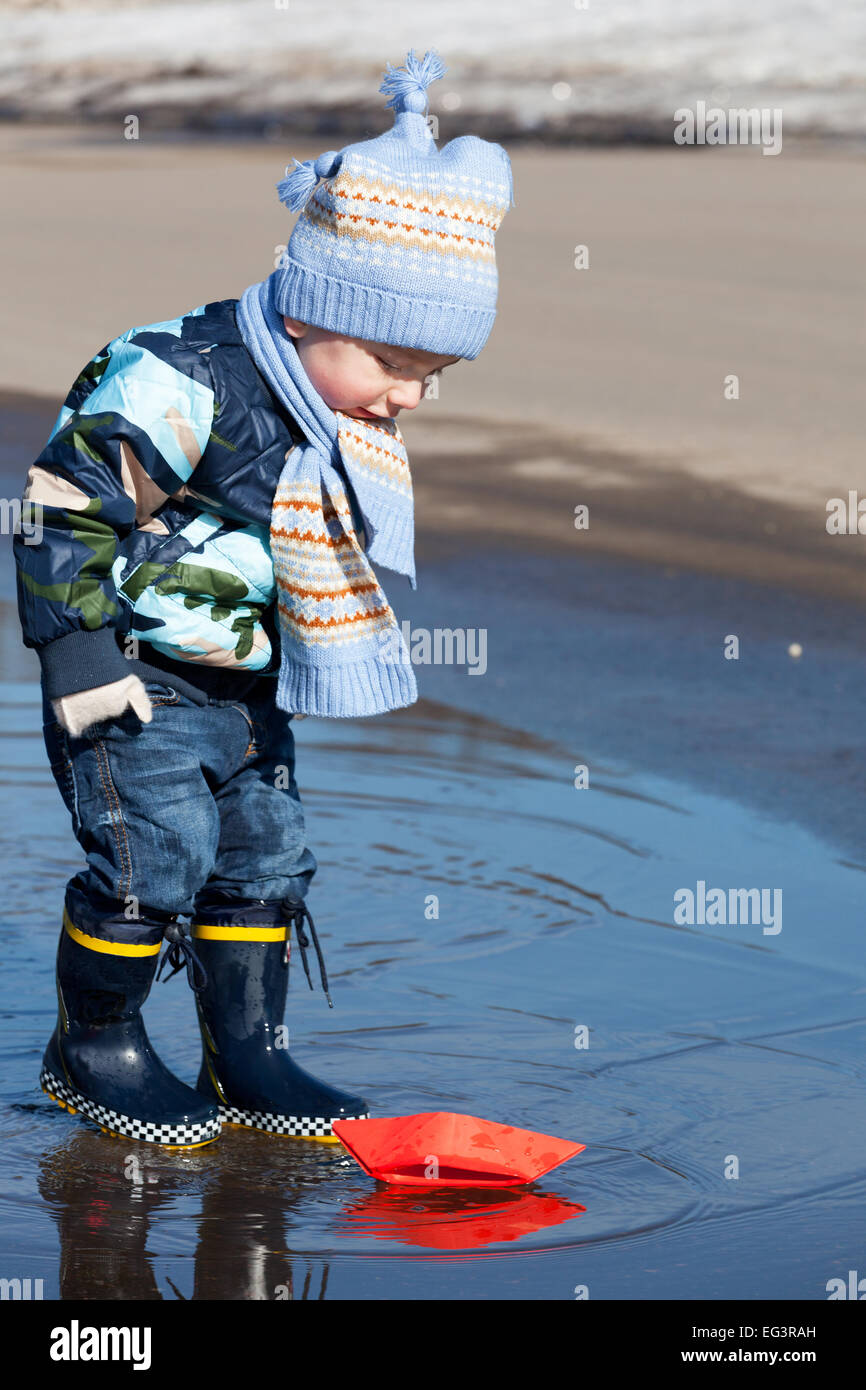 Boy puddle splashing hi-res stock photography and images - Alamy