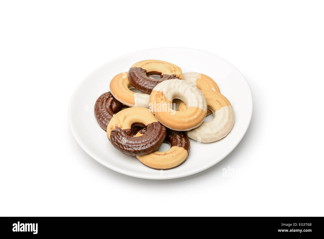 Ring shaped chocolate biscuits in a porcelain plate isolated on white ...
