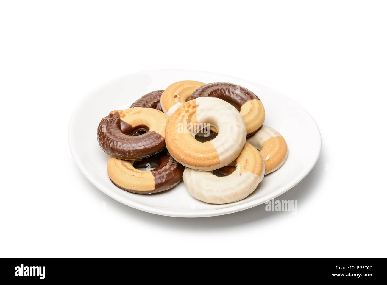 Ring shaped chocolate biscuits in a porcelain plate isolated on white ...