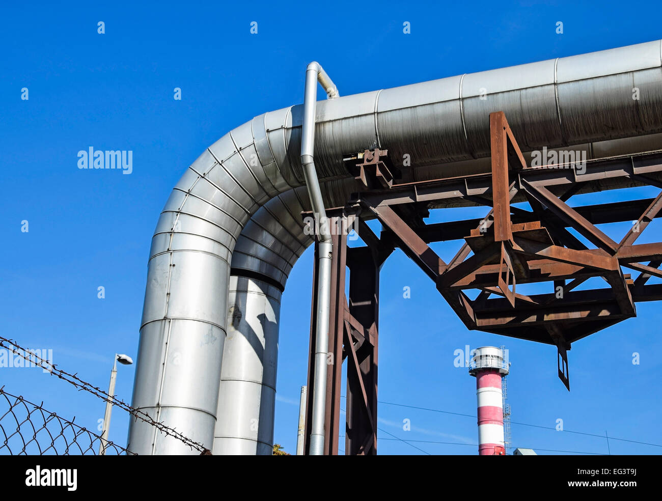 Pipeline and smoke stack of the power station Stock Photo - Alamy
