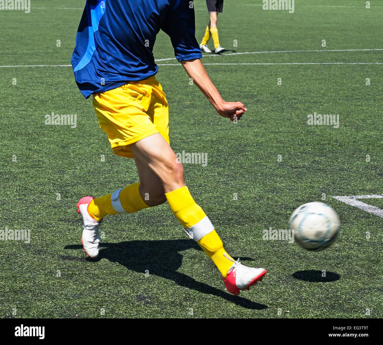 Young soccer player in action Stock Photo - Alamy