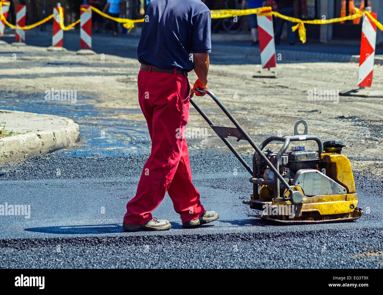 Men is working at the road construction Stock Photo - Alamy