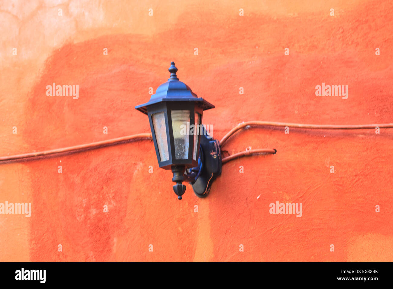 old lamp on the wall, retro background Stock Photo - Alamy