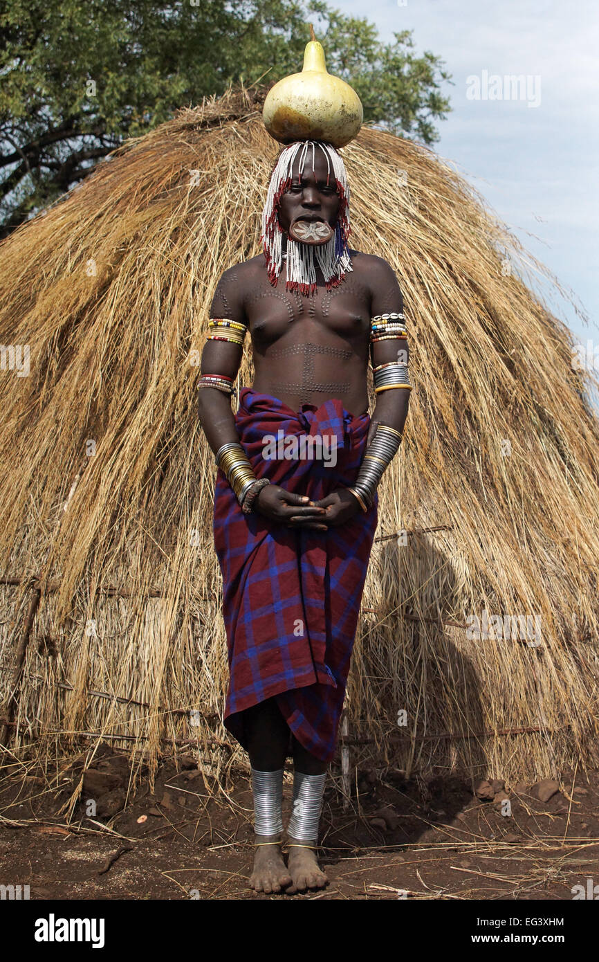 JINKA, ETHIOPIA - NOVEMBER 21, 2014: Mursi woman with traditional lip ...