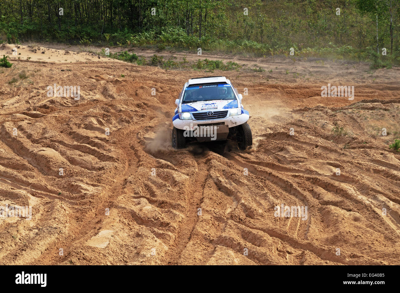Races on a rally-raid on sandy dunes. Rally-raid Baha "Belarus" 2014 ...