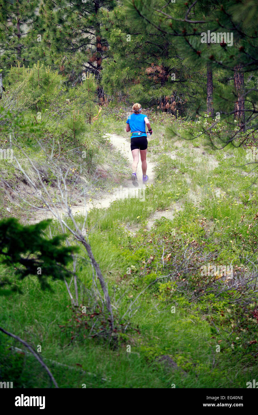 A female runner uses cross-country ski trails at Echo Ridge in the Lake ...