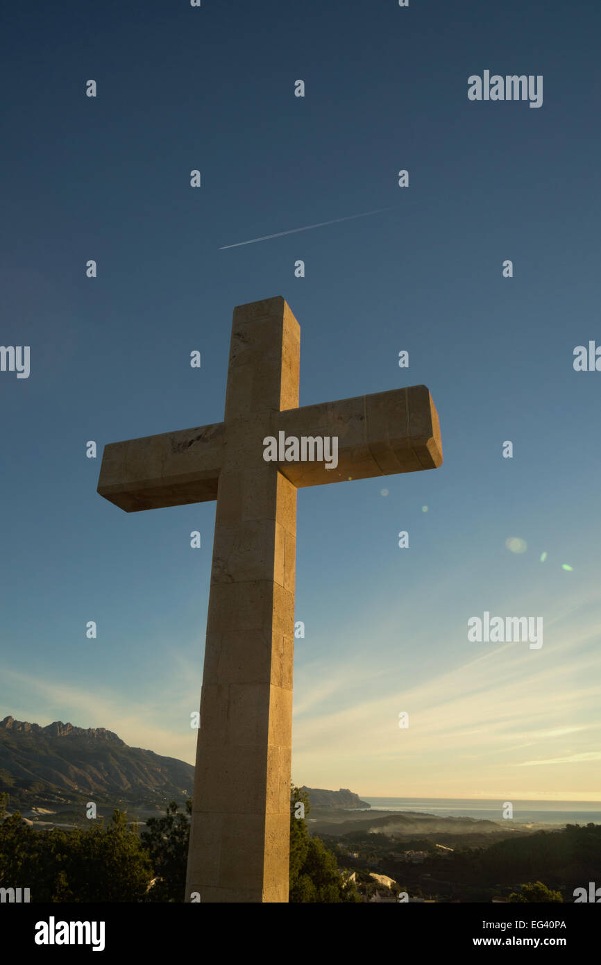 Tall Christian cross under a strong morning sun Stock Photo - Alamy