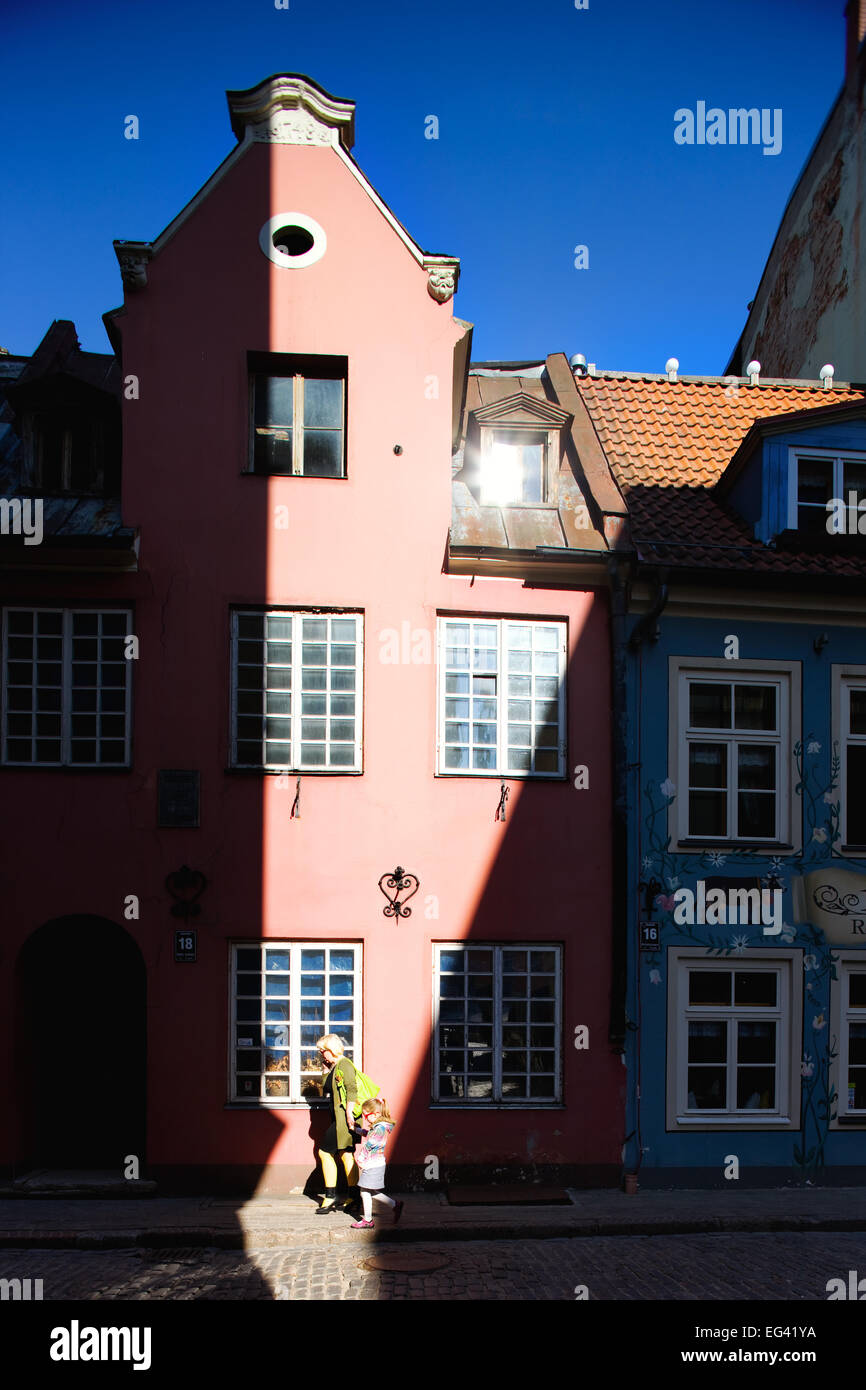 Passerby walking down the street of the old town spring Stock Photo - Alamy
