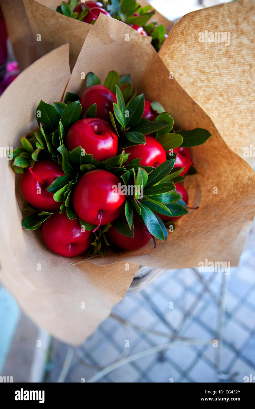 Decorative bunch with red apple and laurel leaves Stock Photo - Alamy