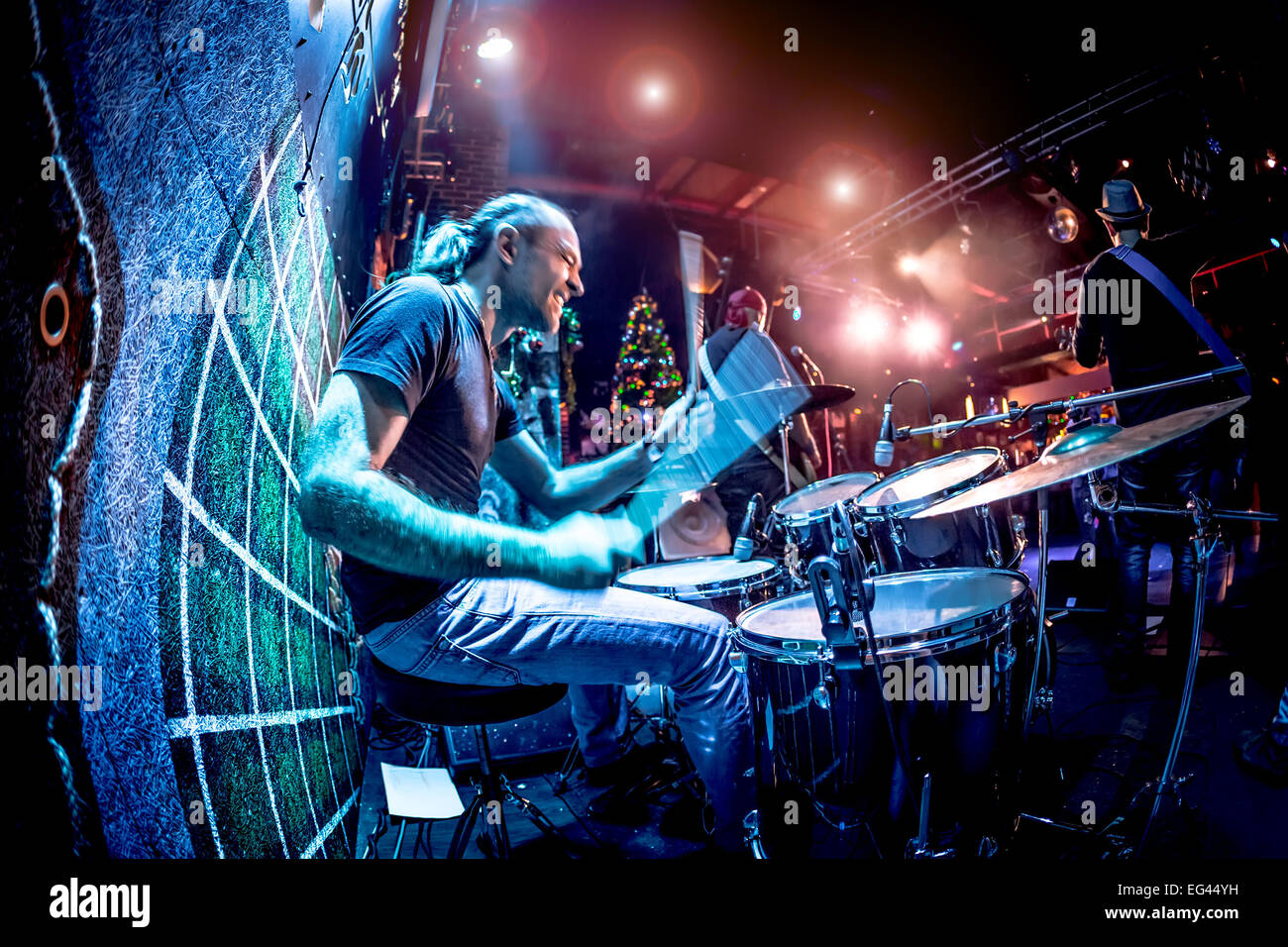 Drummer playing on drum set on stage. Warning - Focus on the drum ...
